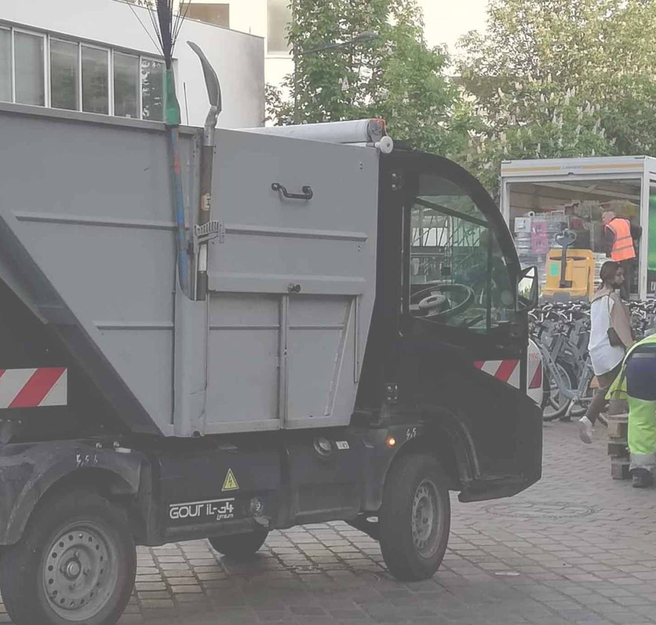 Electric utility truck for garbage collection and management